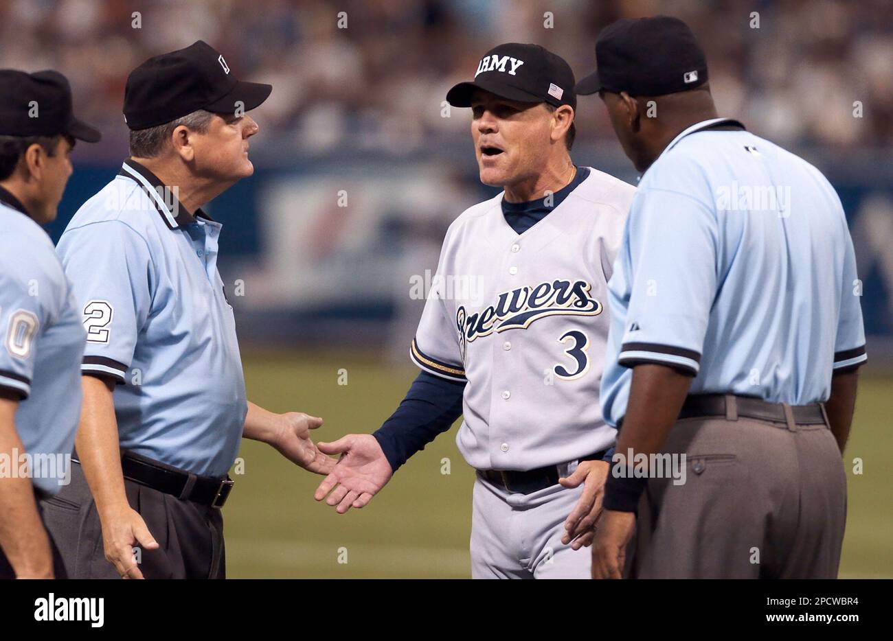 Milwaukee Brewers manager Ned Yost (3) questions umprires, from left ...