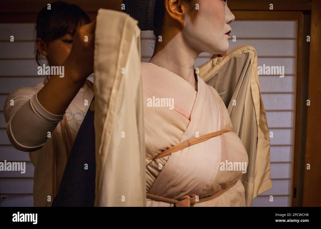 Toshiyu dressing in her Okiya (geisha house).Geisha from geisha's distric of Miyagawacho.Kyoto ...