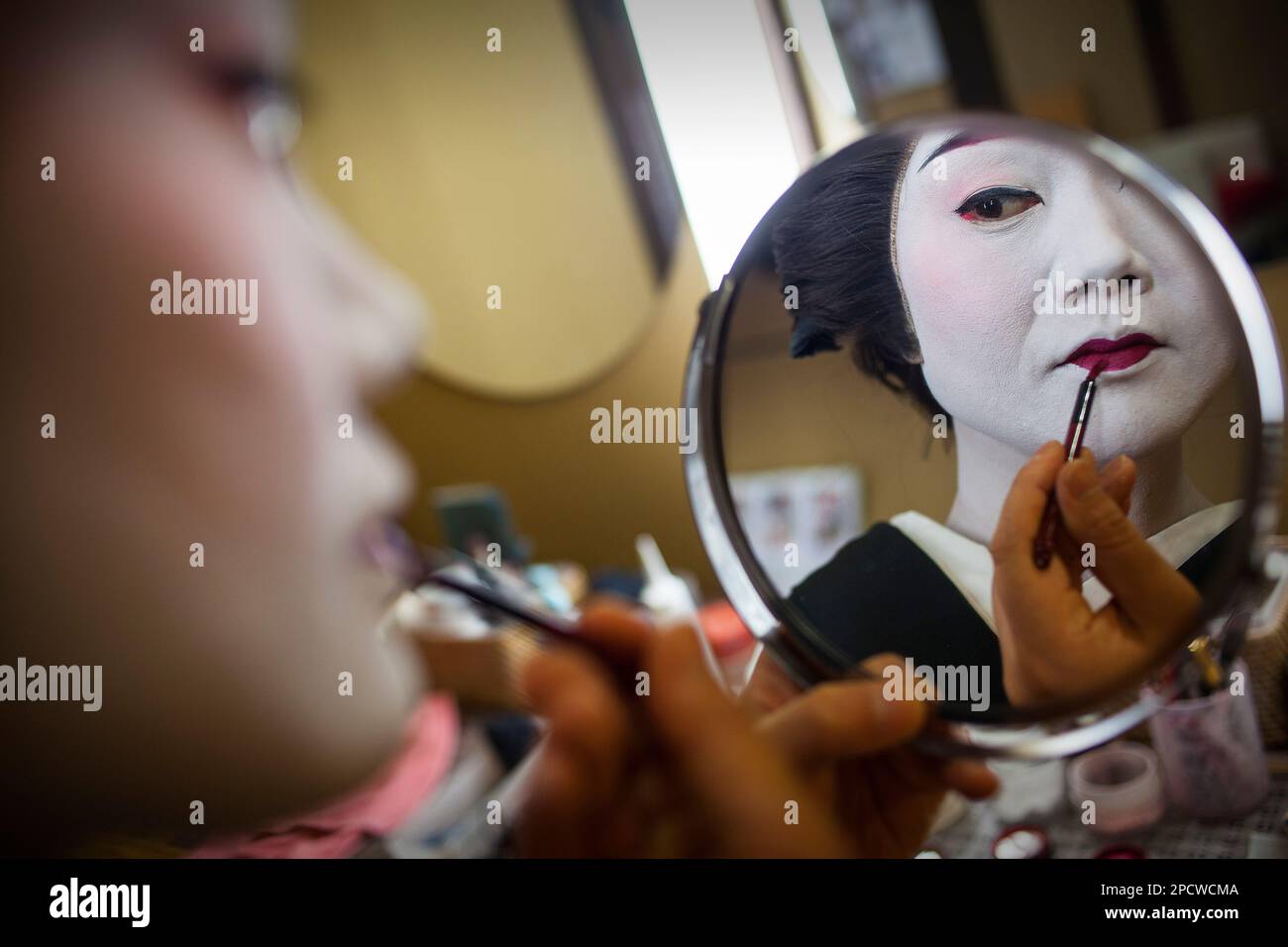 Toshiyu applying makeup in her Okiya (geisha house).Geisha from geisha ...