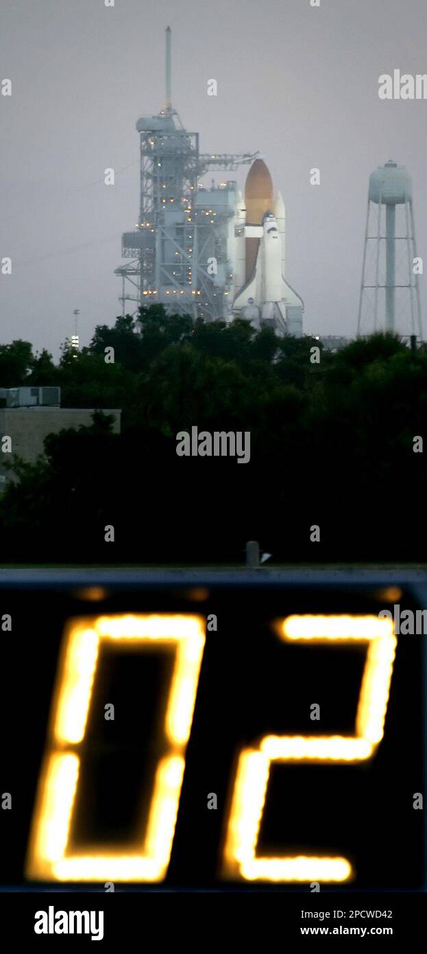 The launch clock at the Kennedy Space Center continues to countdown as ...