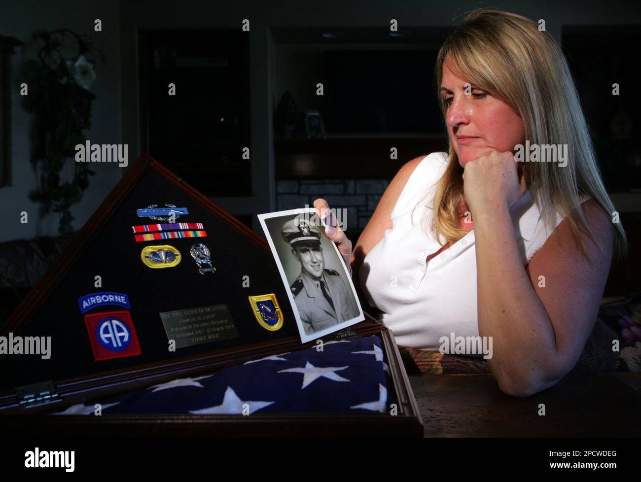 Elaine Roach holds a photo of her father Harold Stuart Roach, Jr. on ...