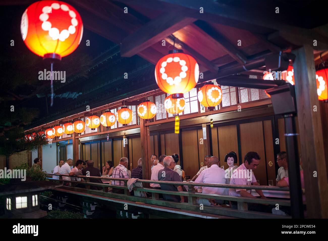 Geishas and clients in Ochaya (tea house).Geisha's distric of ...
