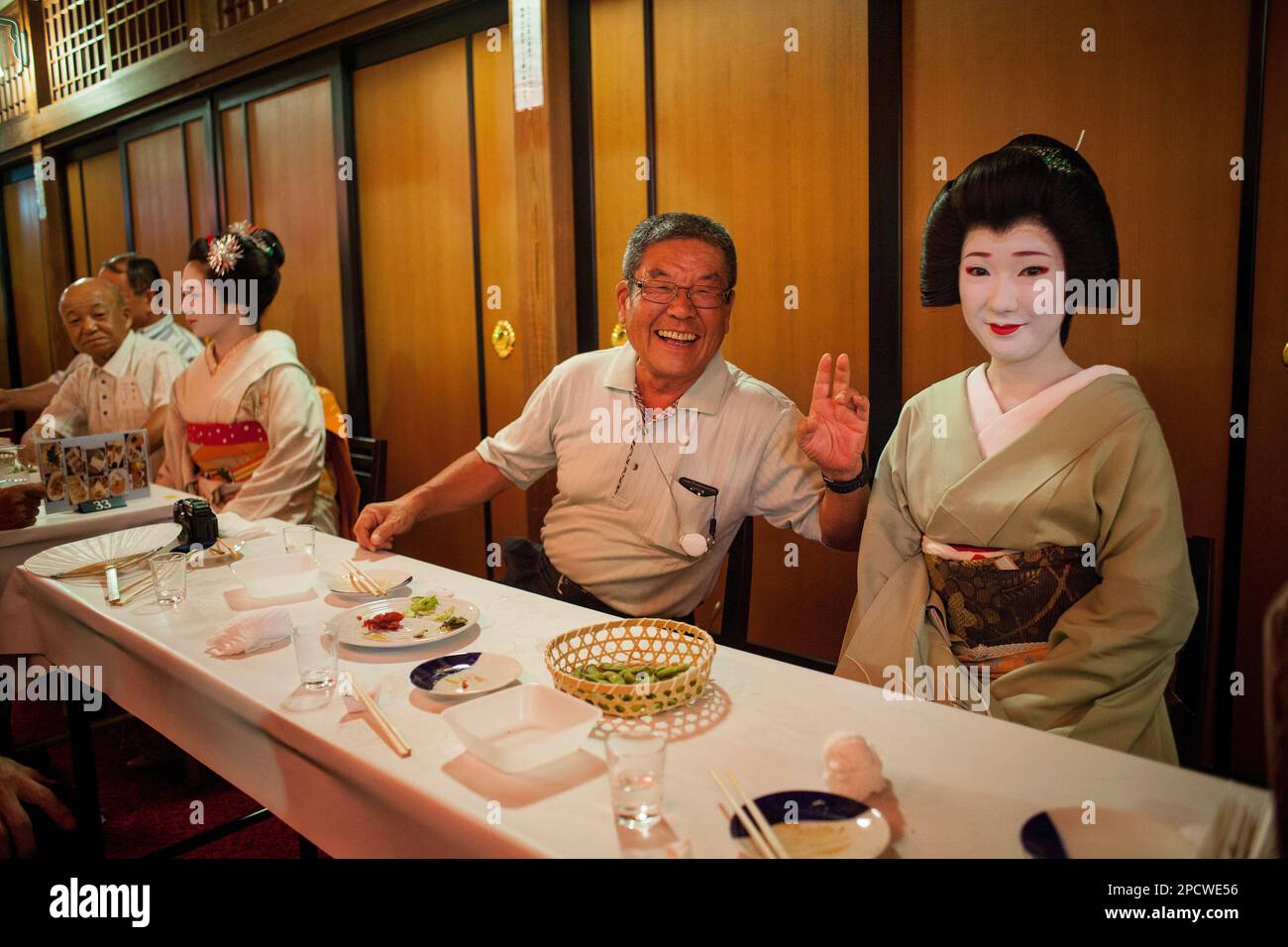 Geishas and clients in Ochaya (tea house).Geisha's distric of ...