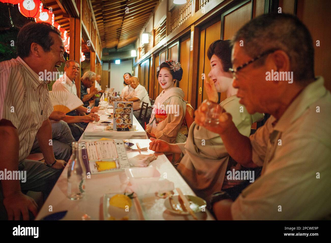 Geishas and clients in Ochaya (tea house).Geisha's distric of ...