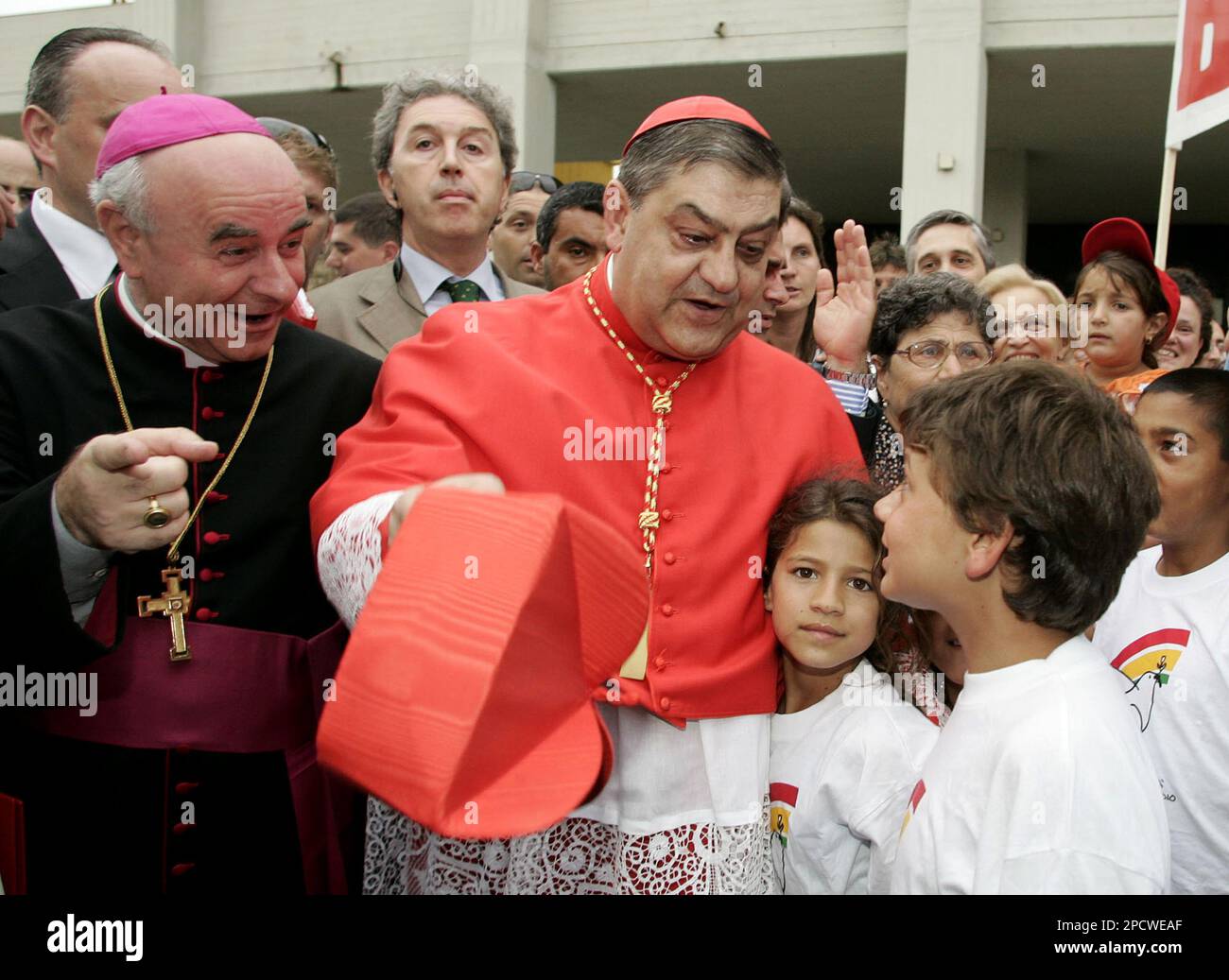 The new Archbishop of Naples Cardinal Crescenzio Sepe, center, is ...