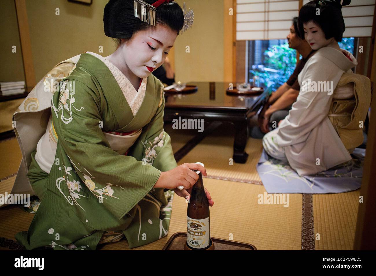 Fukukimi,'maiko' (geisha apprentice) workimg in Miyaki tea house (o ...