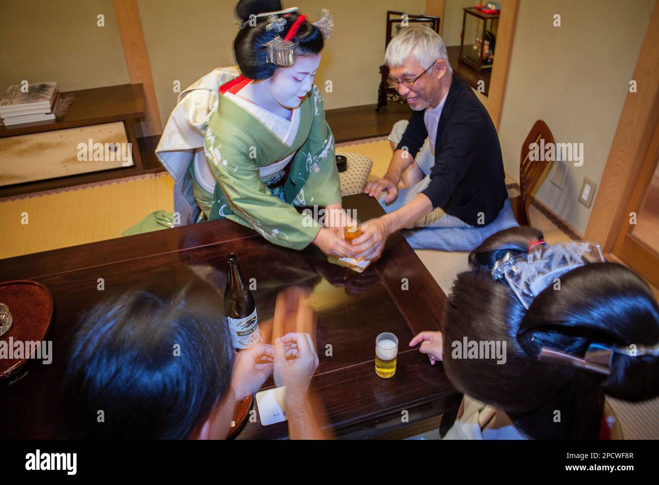 Fukuyu,geisha and Fukukimi,'maiko' (geisha apprentice) workimg in ...