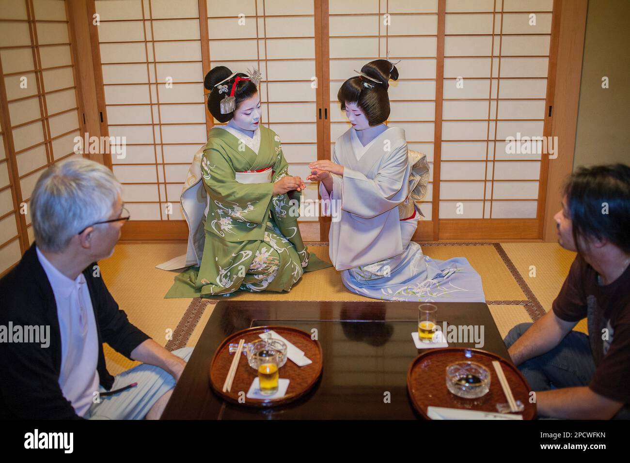Fukuyu,geisha and Fukukimi,'maiko' (geisha apprentice) workimg in ...