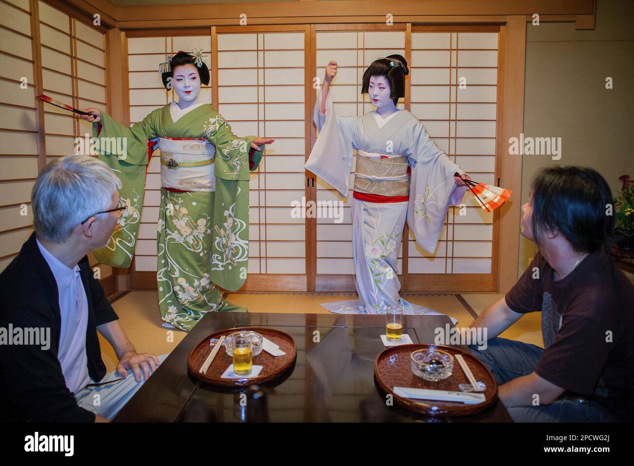 Fukuyu,geisha and Fukukimi,'maiko' (geisha apprentice) workimg in ...