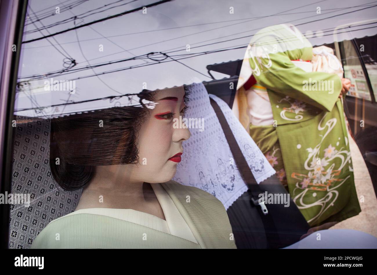 Fukuyu,geisha and Fukukimi,'maiko' (geisha apprentice)in taxi going to ...