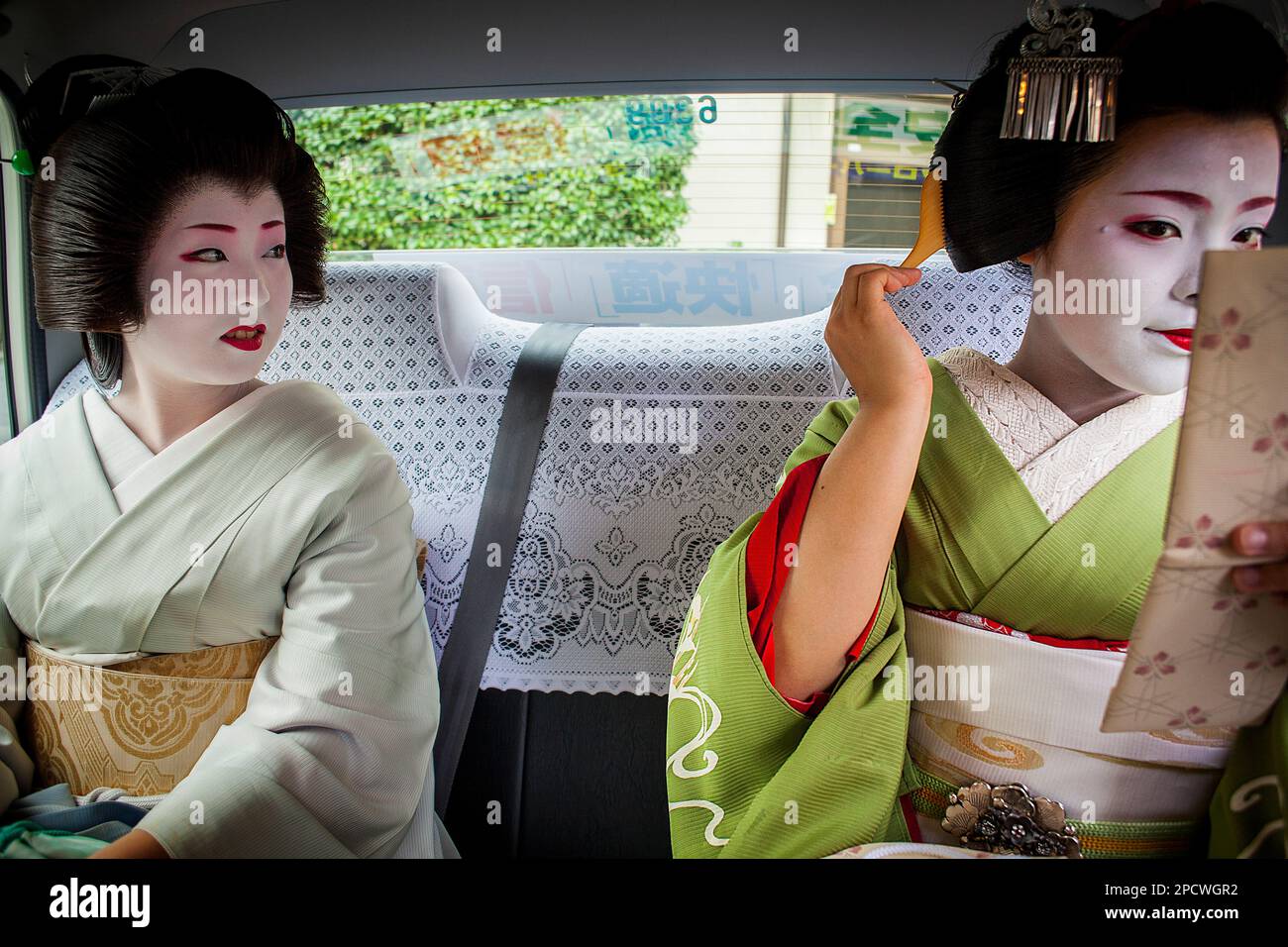 Fukuyu,geisha and Fukukimi,'maiko' (geisha apprentice)in taxi going to ...
