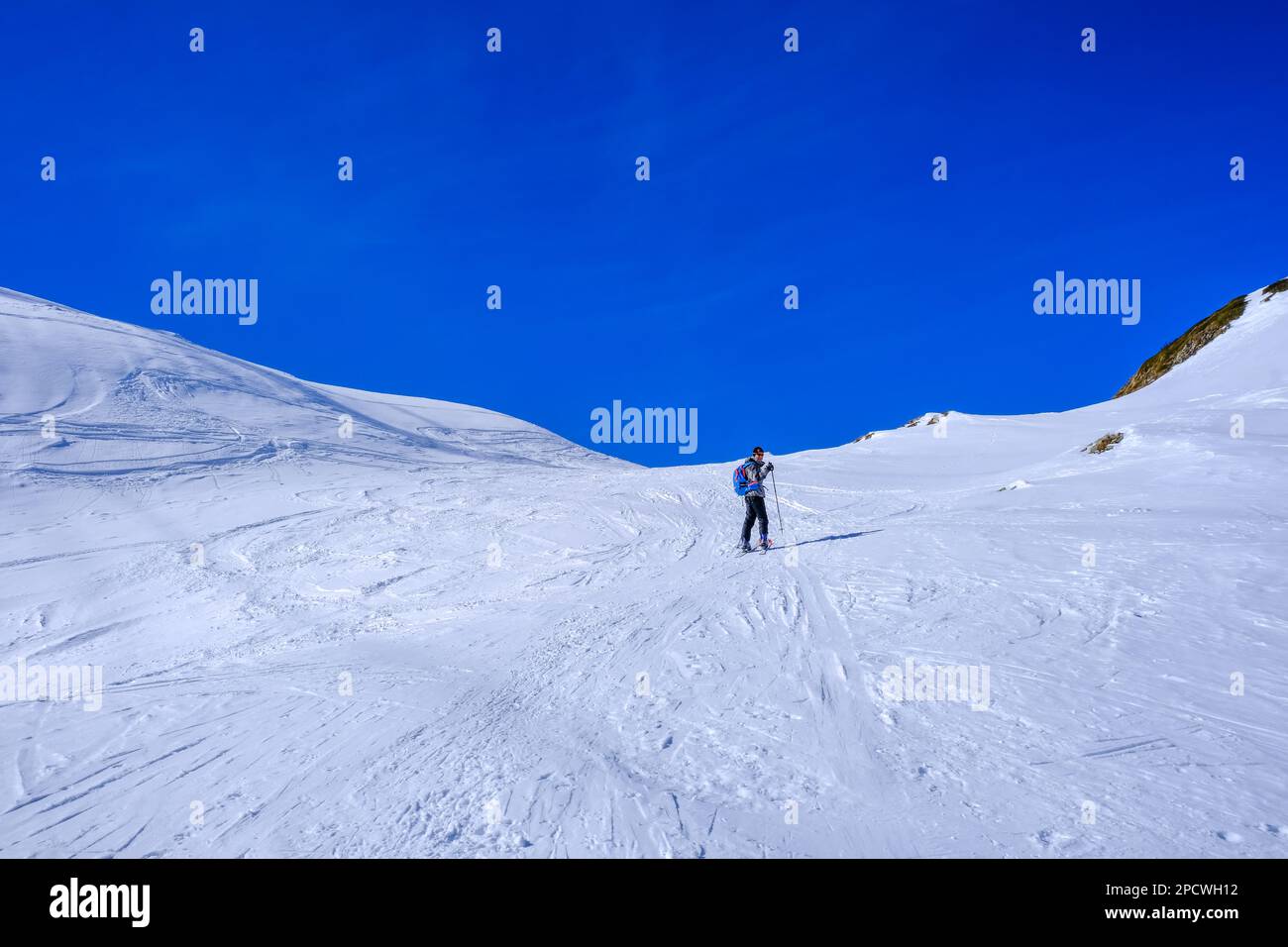 Ski alpinist climbing the Bedretto Valley, Grigioni, Switzerland Stock ...