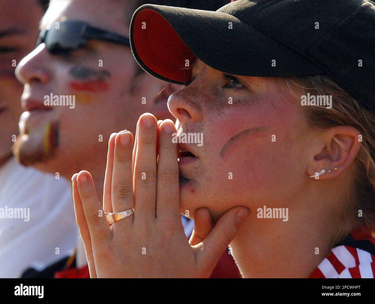 German soccer fans react in a public viewing area in Frankfurt, Germany ...