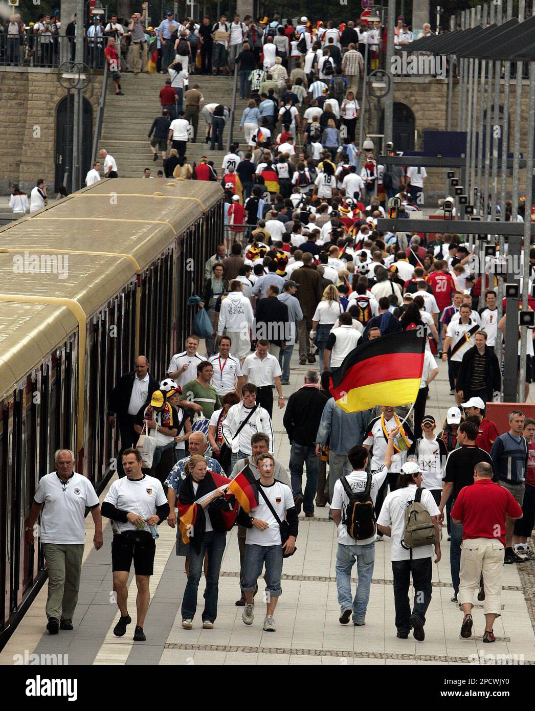 Soccer fans arrive at the Olympiastadion train stop on their way to the ...