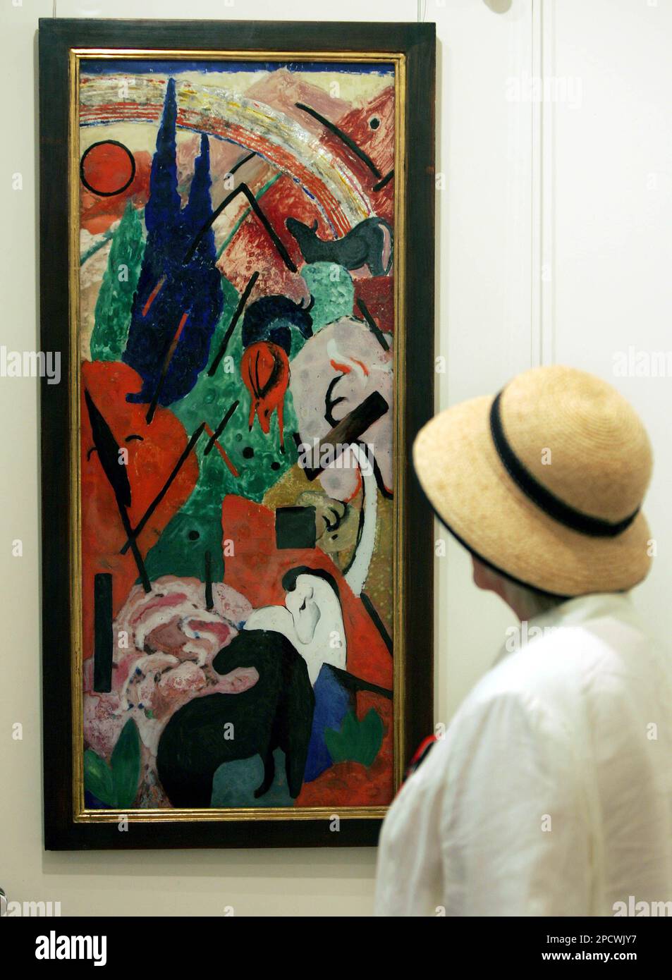 A visitor stands in front of the painting "Landscape with animals and ...