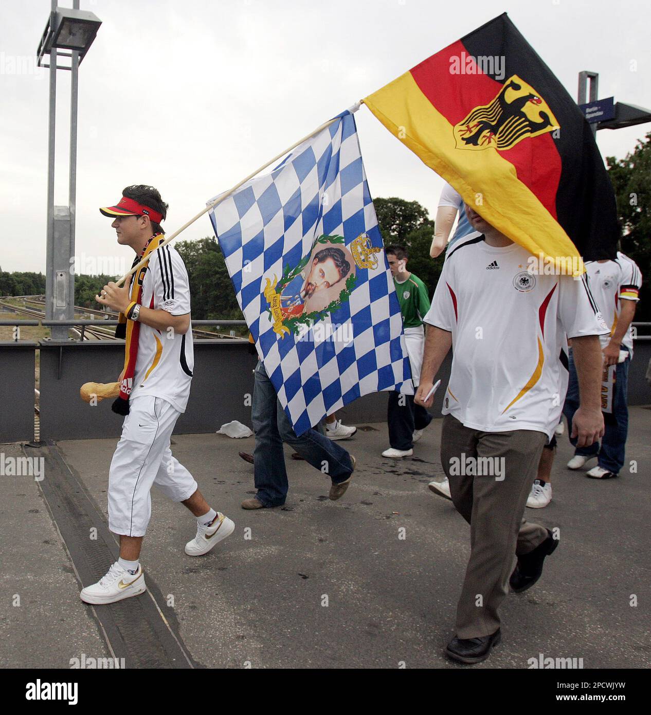 German soccer fans head to Olympic Stadium after arriving at the ...