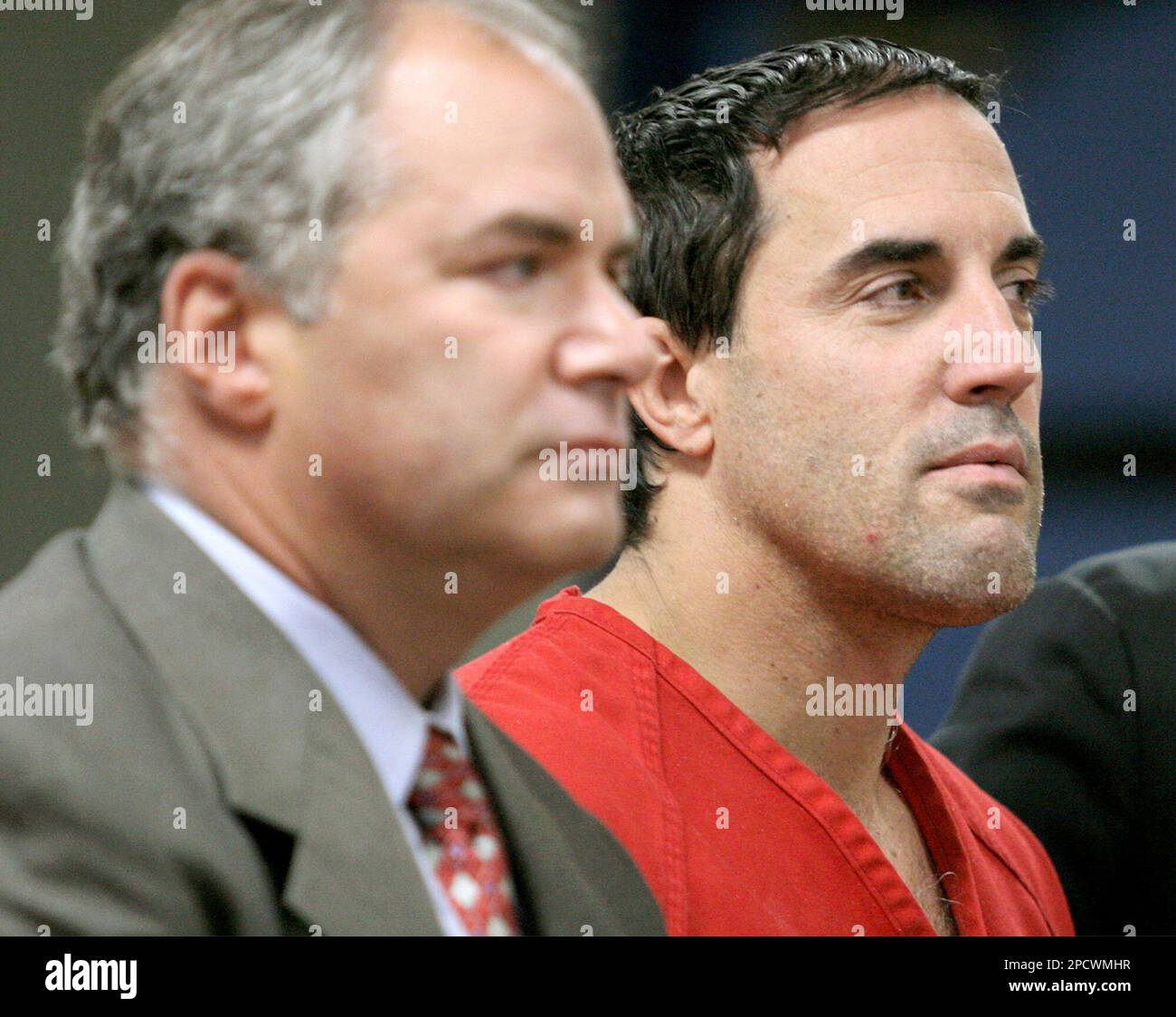 Murder suspect Darren Mack, right, listens with defense attorney Scott ...