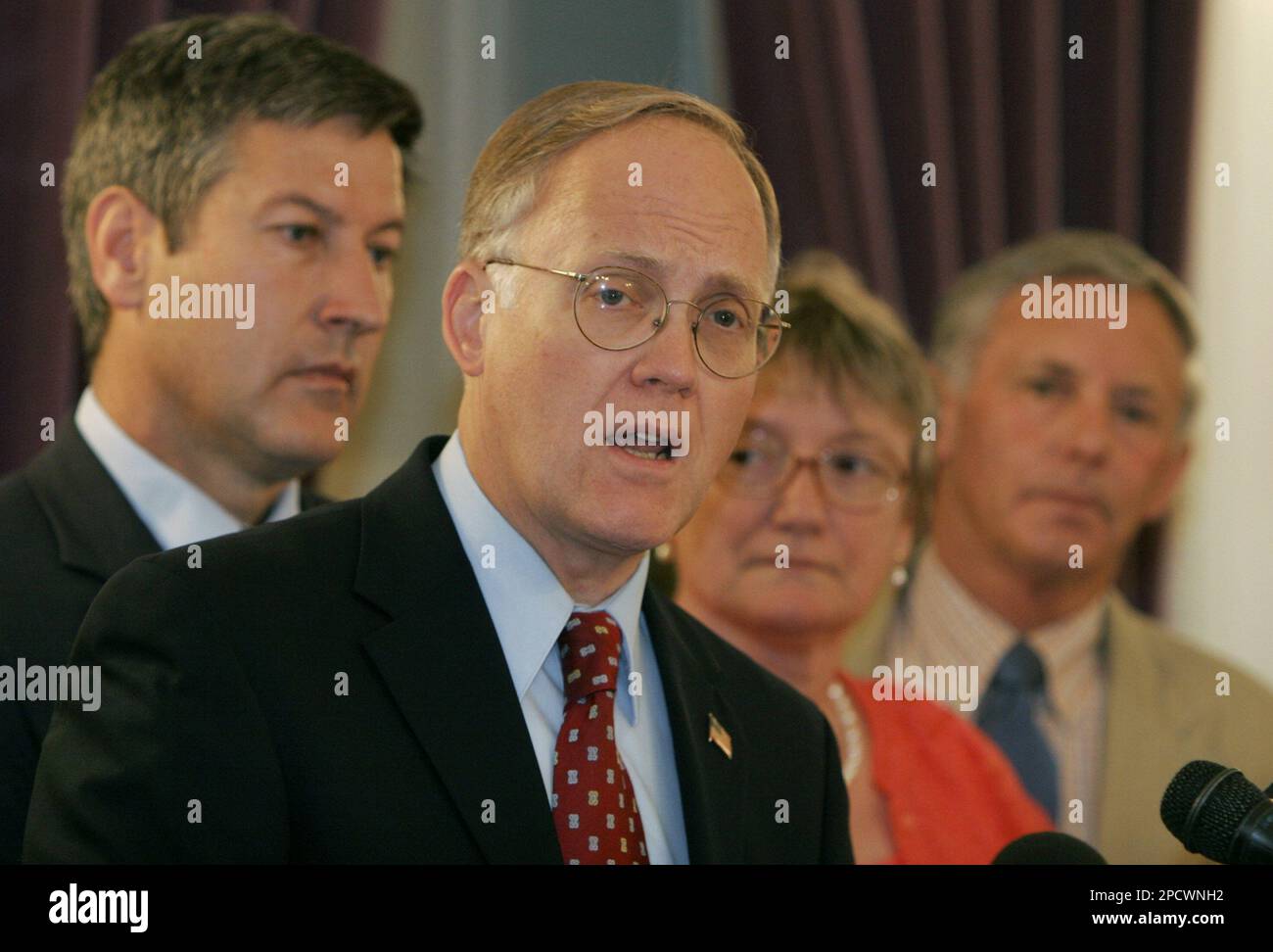 Gov. Jim Douglas, center, speaks at a dairy summit in Montpelier, Vt ...