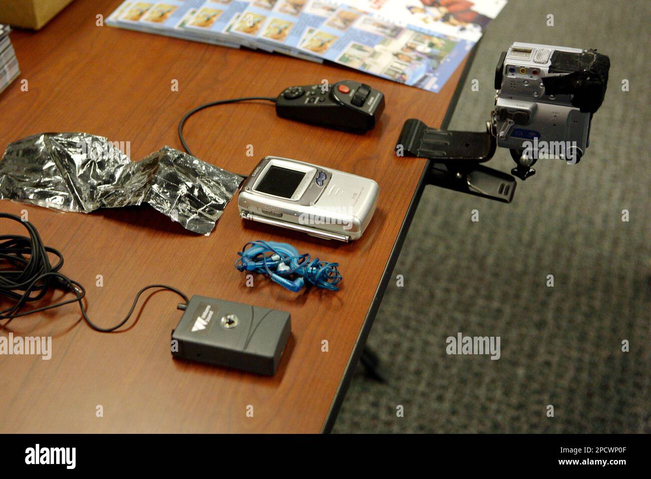 Equipment used to make counterfeit DVDs are displayed at a new ...