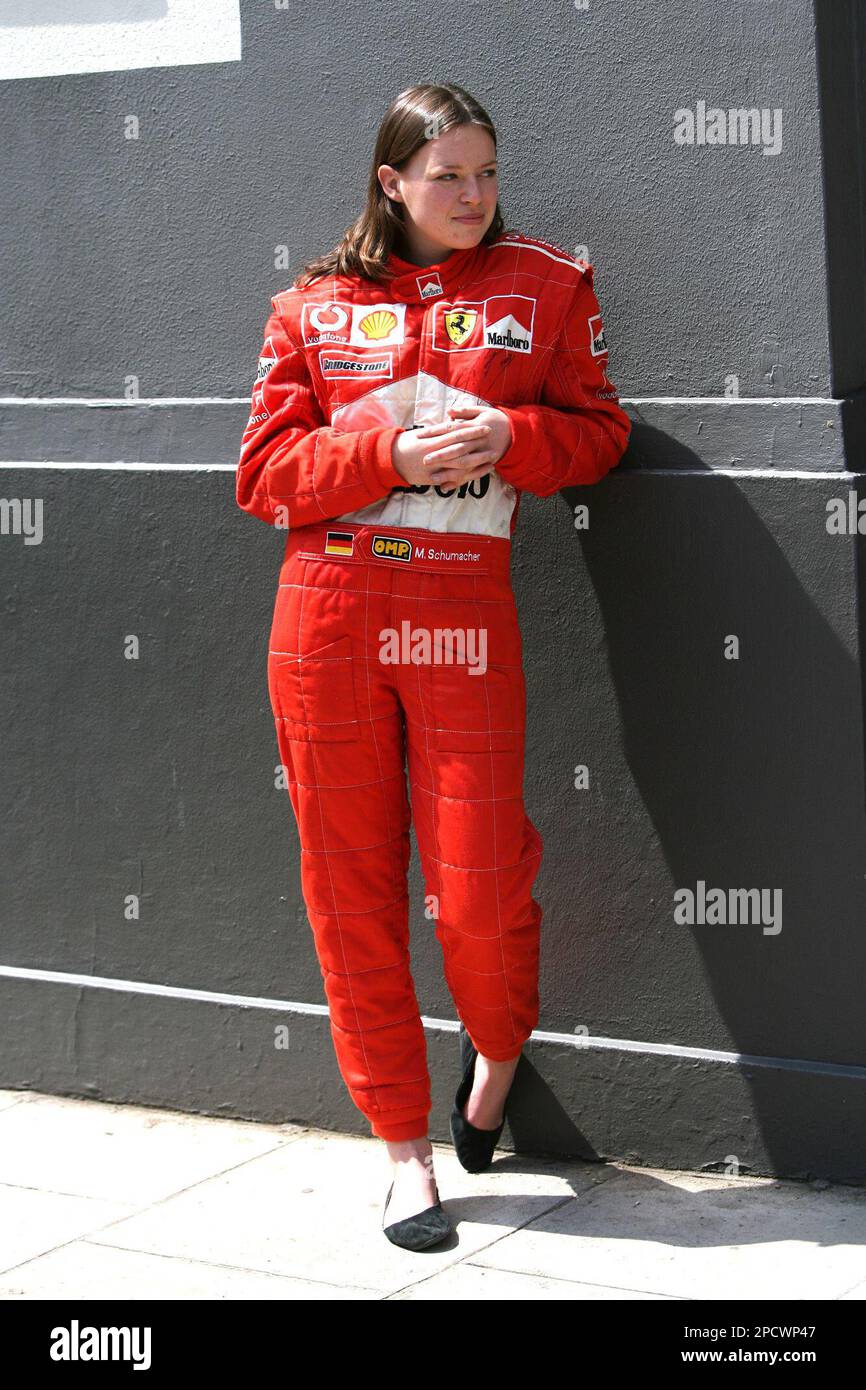Laura Turnbull models a suit worn by Michael Schumacher at the 2002 ...