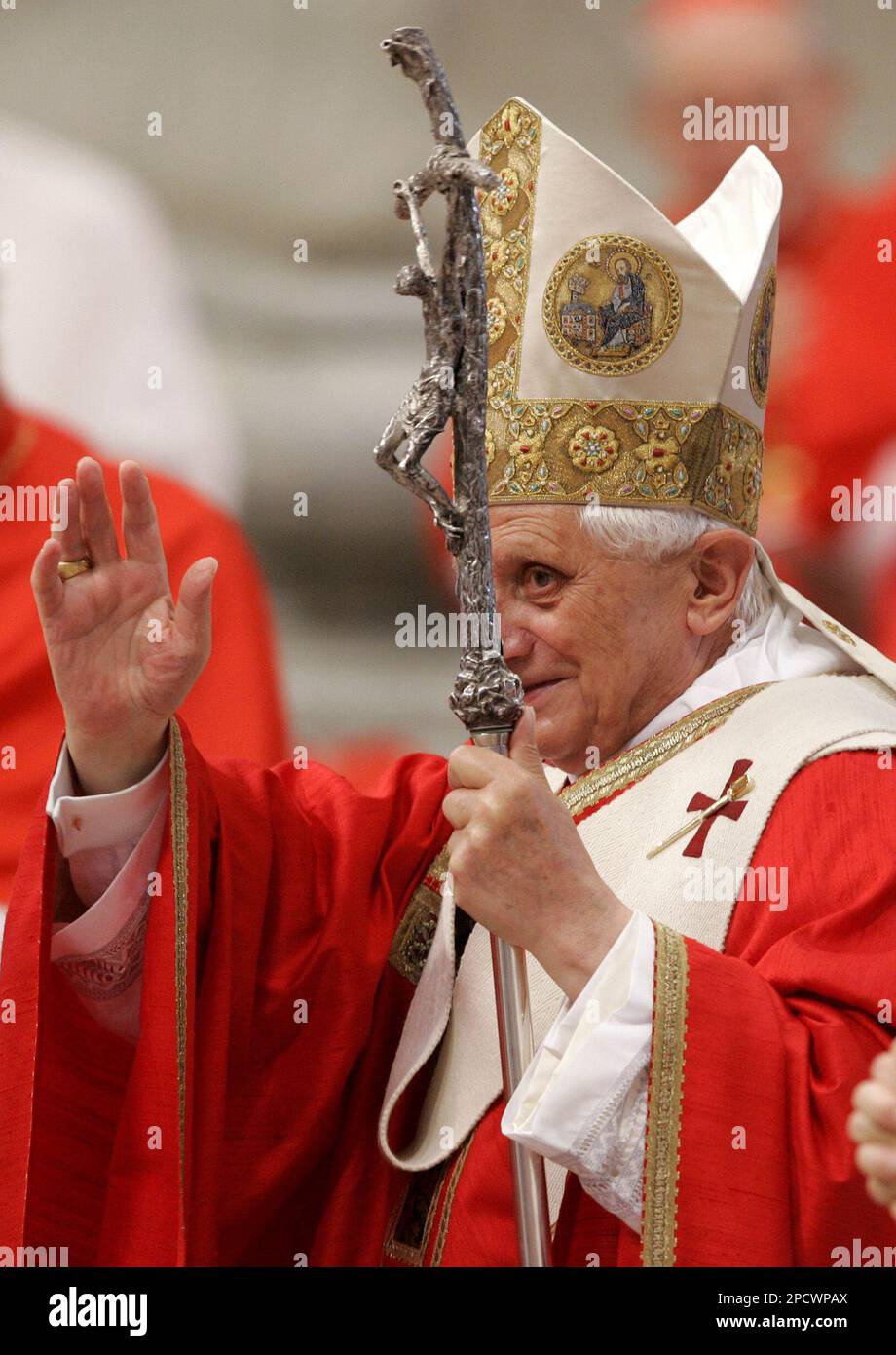 Pope Benedict XVI waves as he arrives for a mass in St. Peter's ...