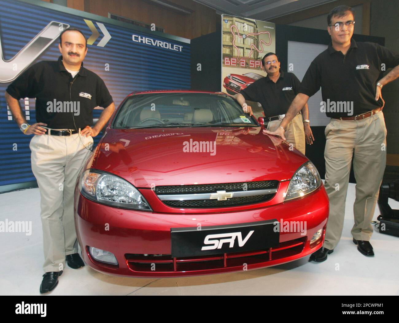 General Motors India President Rajeev Chaba, front right, Vice ...