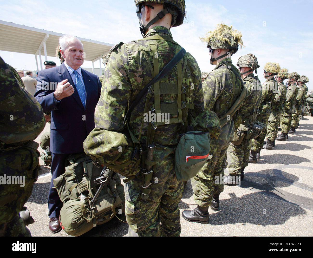 Minister of National Defence Gordon O'Connor, left, greets soldiers at ...