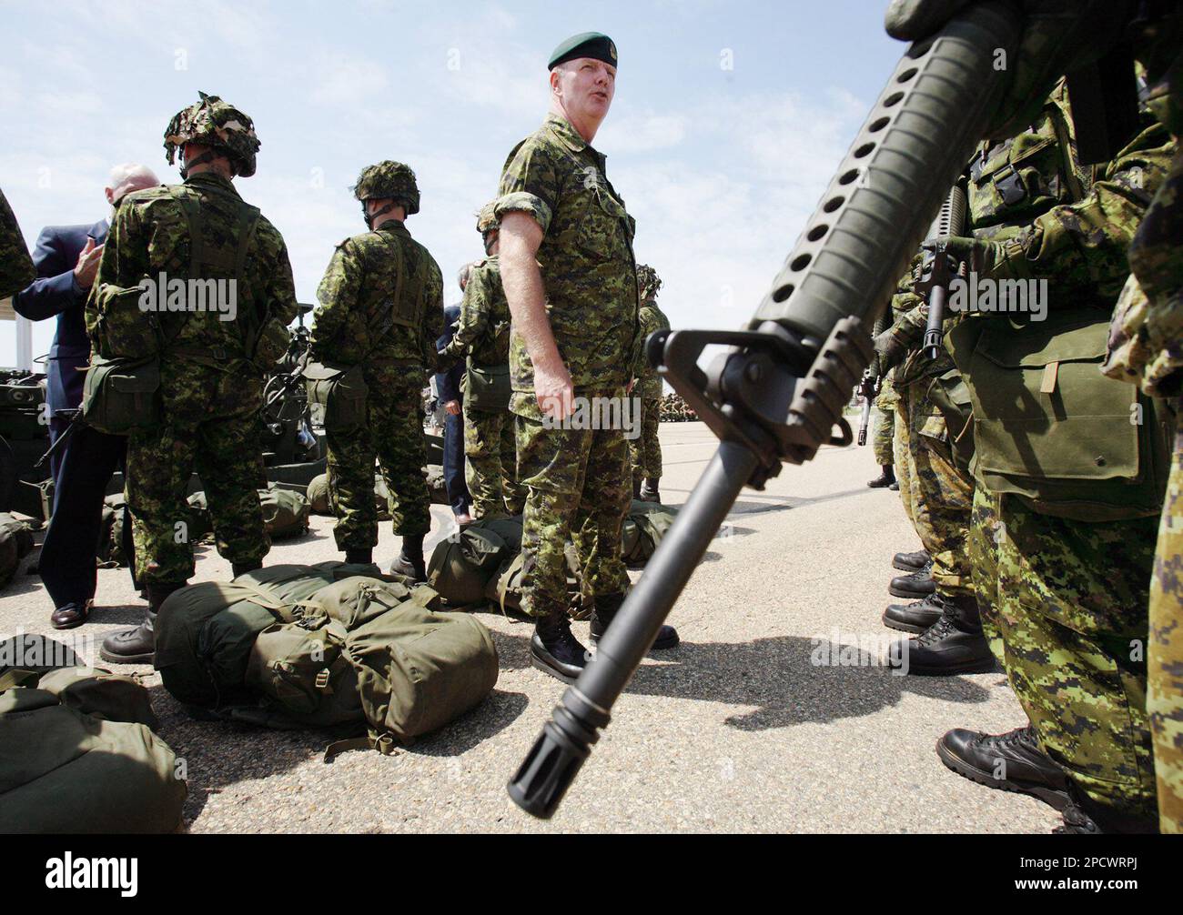 Defence Staff General Rick Hillier, center, greets soldiers at the ...