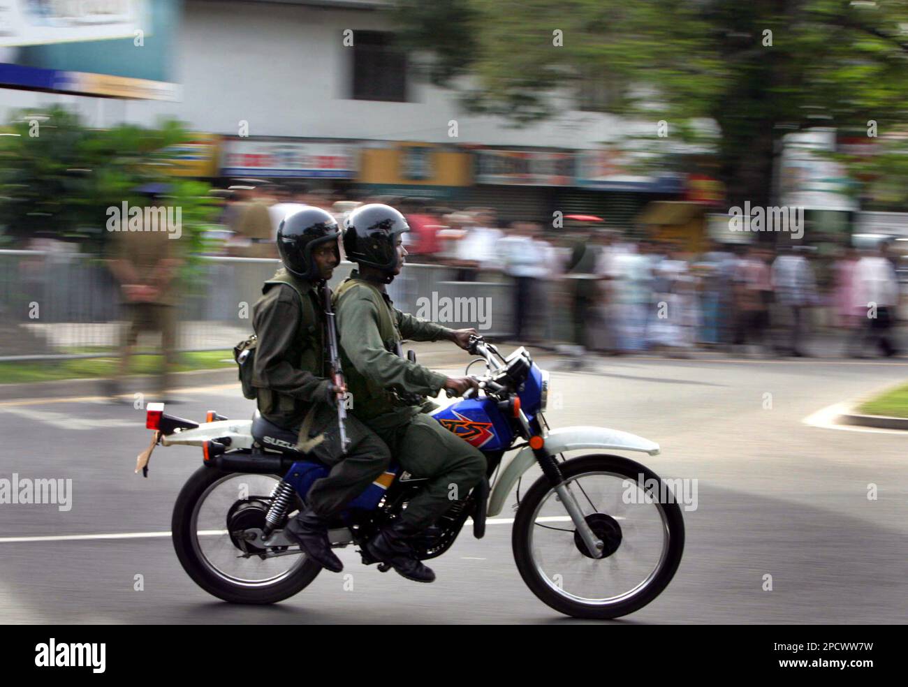Sri Lankan army soldiers patrol on a motorbike during the funeral ...