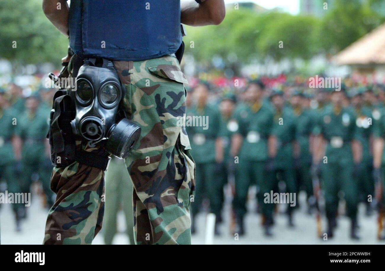 A Sri Lankan army commando stands guards during the funeral of Sri ...