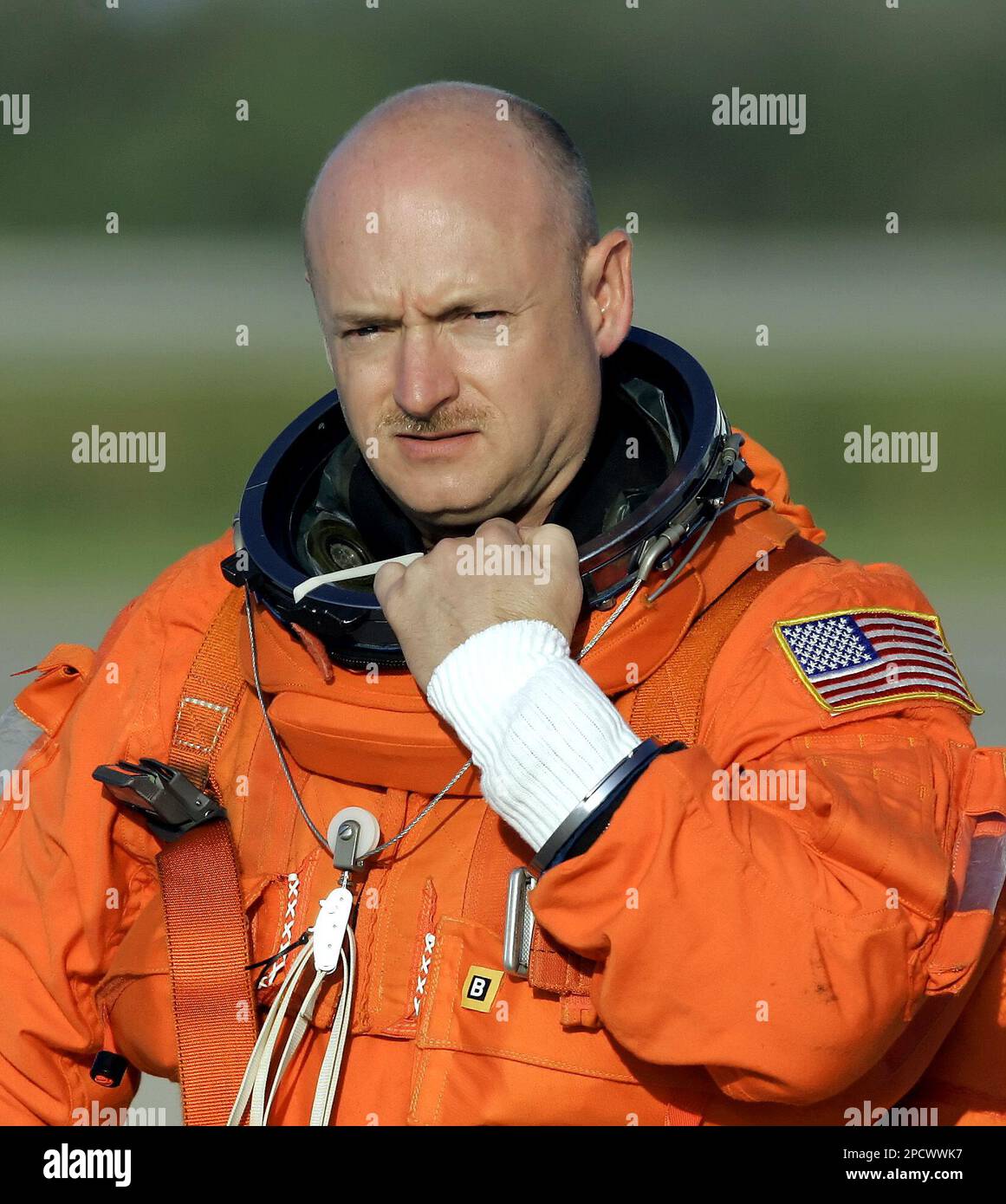 STS-121 pilot Mark Kelly adjusts his launch and entry suit after flying ...