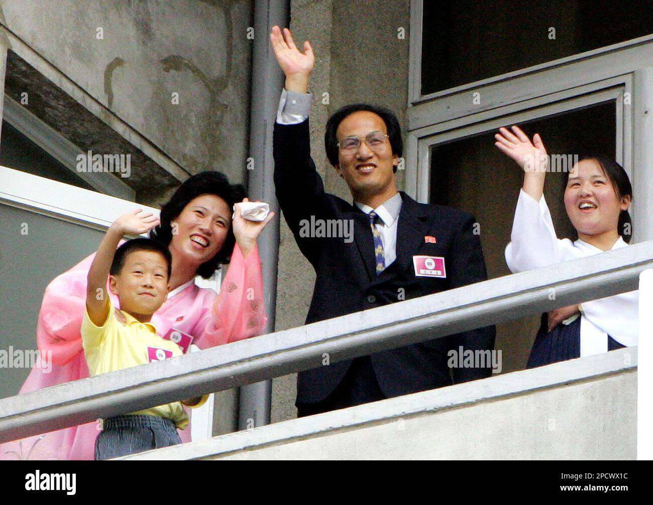 North Korean Kim Young Nam, second from right, waves with his wife Pak ...