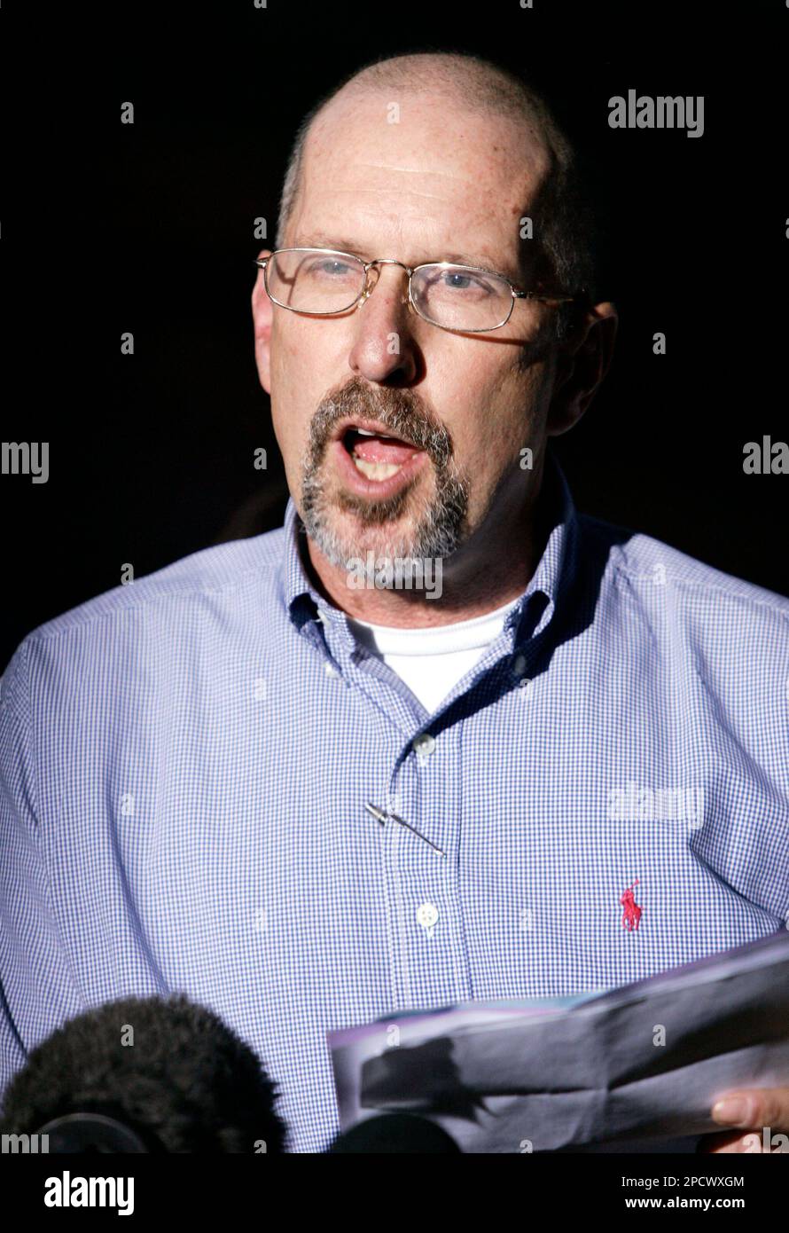 George Benton, husband of victim Claudia Benton, makes remarks to the ...