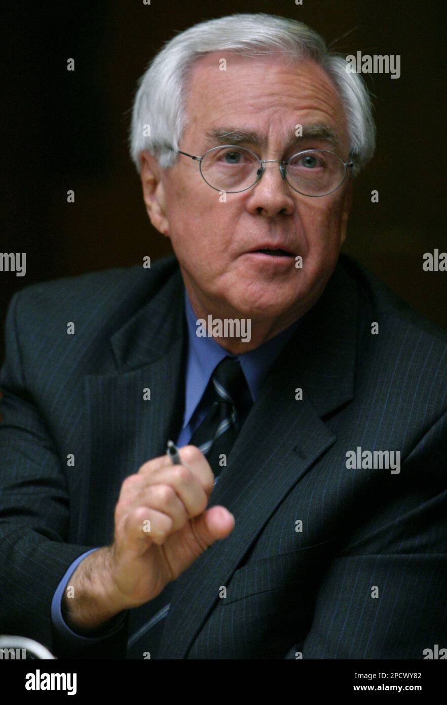 Dr. Charles William Mercer talks with one of his attorneys during a ...