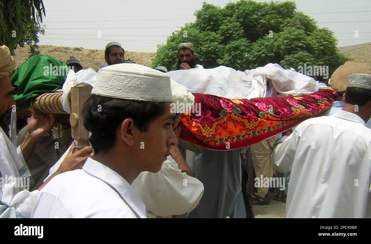 Pakistani tribals carry a dead body of para-military soldier who was ...
