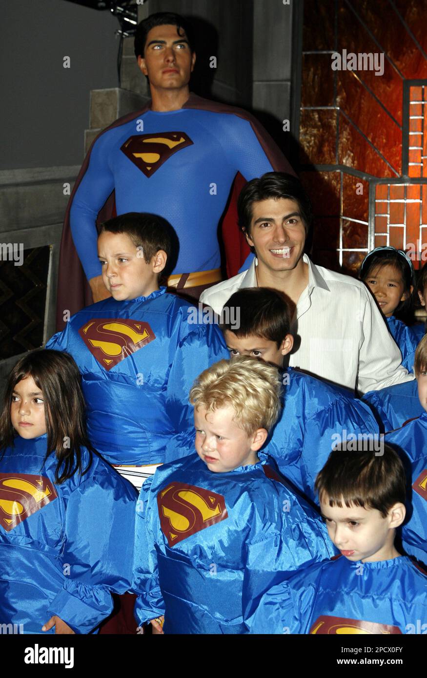 Brandon Routh, in white shirt, star of "Superman Returns," poses with a ...