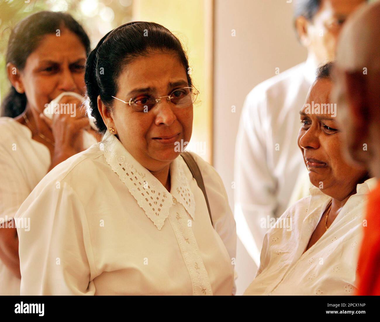 Relatives mourn near the body of Sri Lankan army Maj. Gen. Parami ...