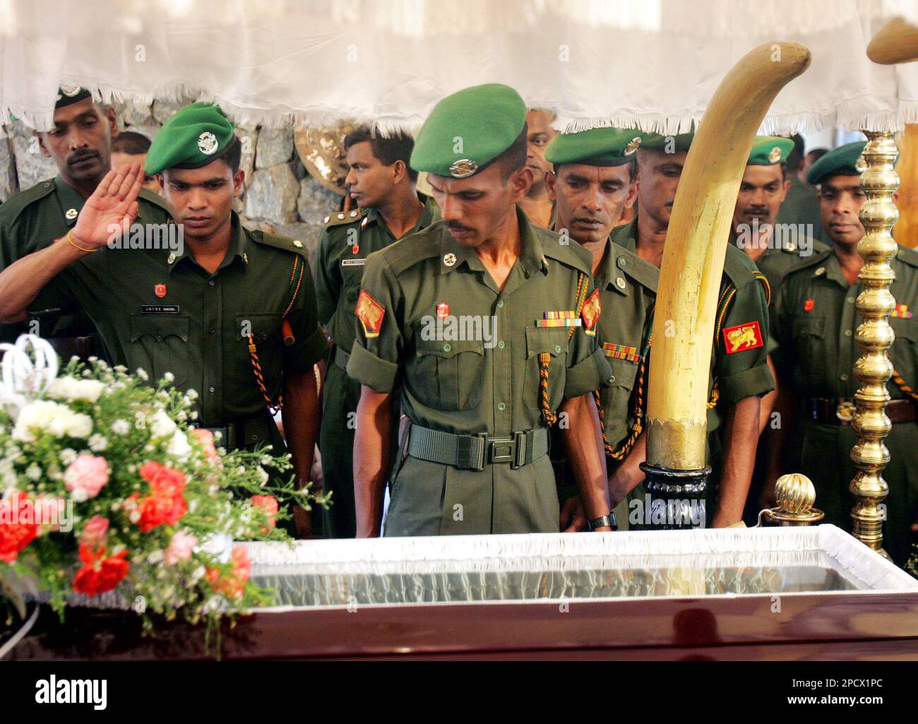 Sri Lankan army soldiers pay tribute to Maj. Gen. Parami Kulatunga, in ...