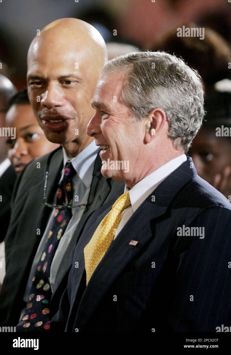 President Bush, right, takes his seat next to NBA basketball hall-of ...
