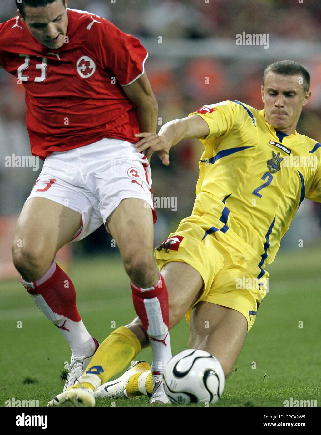Switzerland's Philipp Degen, left, and Ukraine's Andriy Nesmachnyi ...