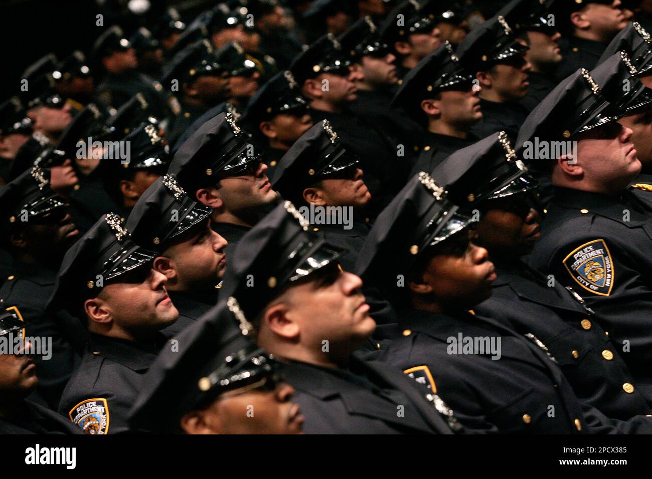 Police academy graduates attend a graduation ceremony, Monday, June 26 ...
