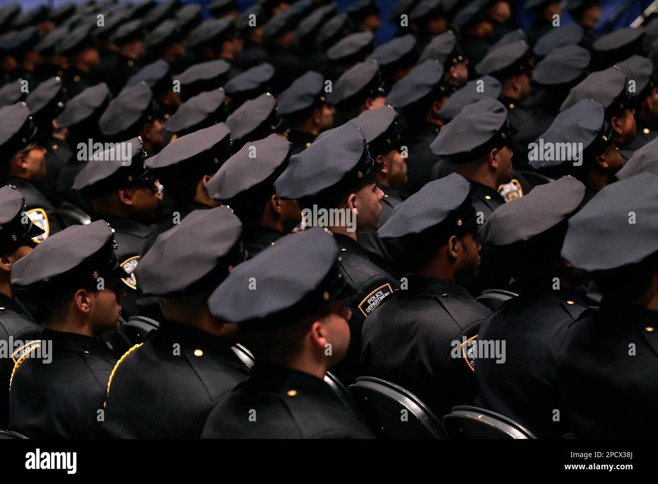 Police academy graduates attend a graduation ceremony, Monday, June 26 ...