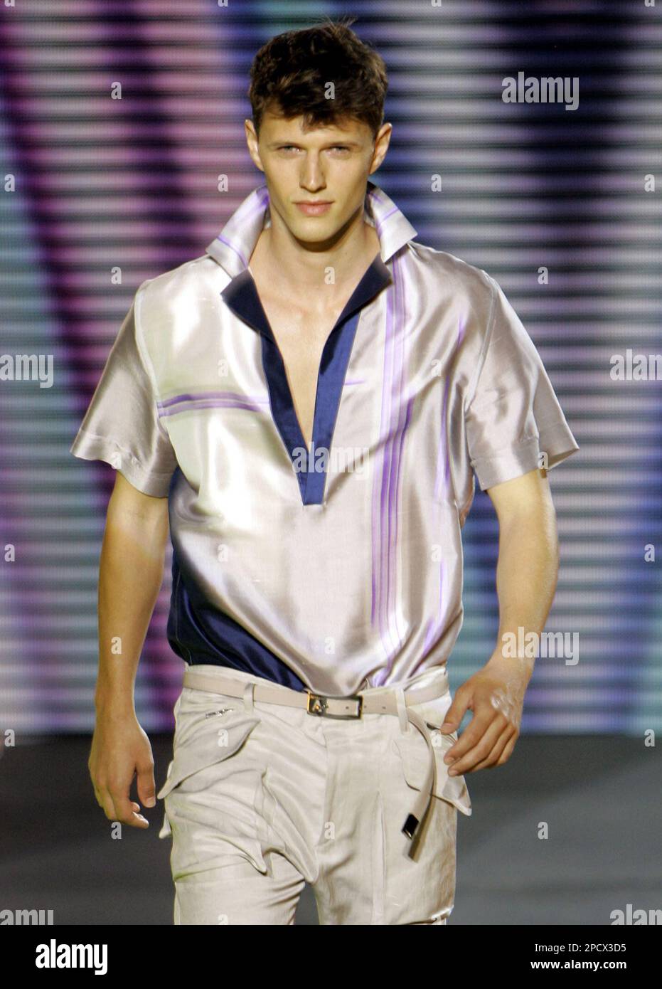 A model wears a creation part of Gianni Versace Spring-Summer 2007 men ...