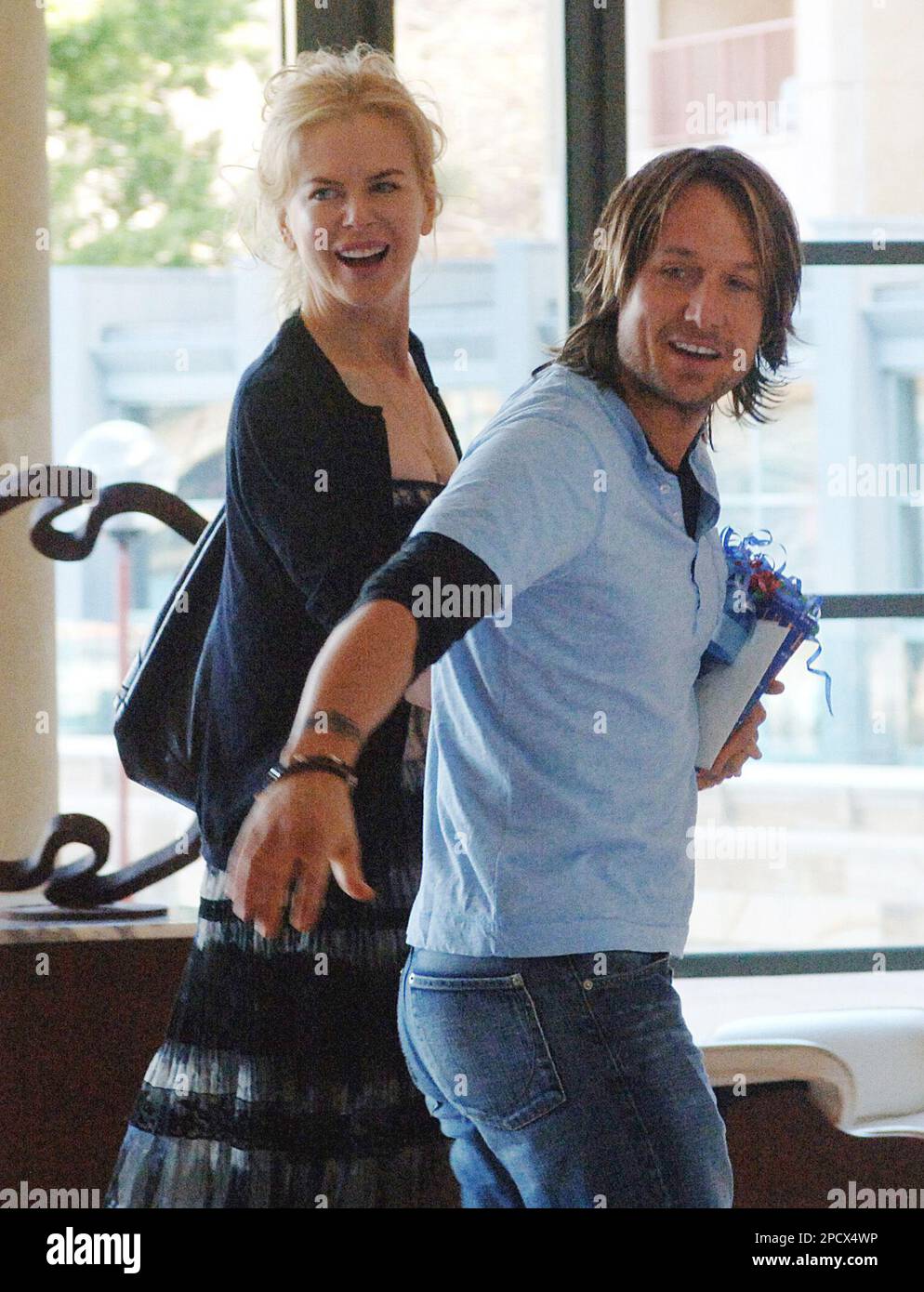 Australian actress Nicole Kidman, left, walks with her husband and ...