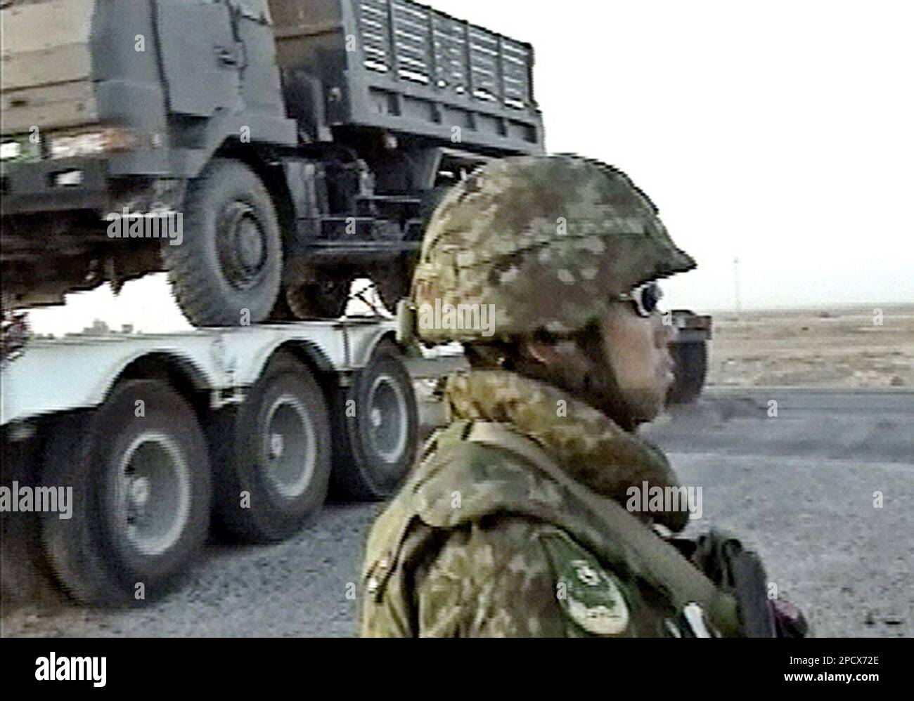 Japan Ground Self Defense Force (JGSDF) personnel stands guard as a ...