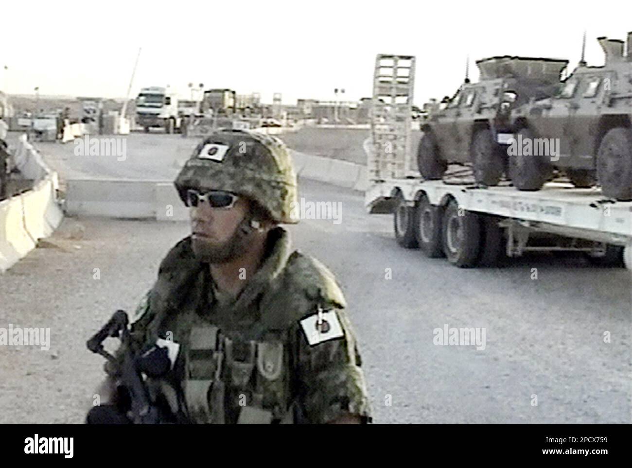 Japan Ground Self Defense Force (JGSDF) personnel stands guard as a ...