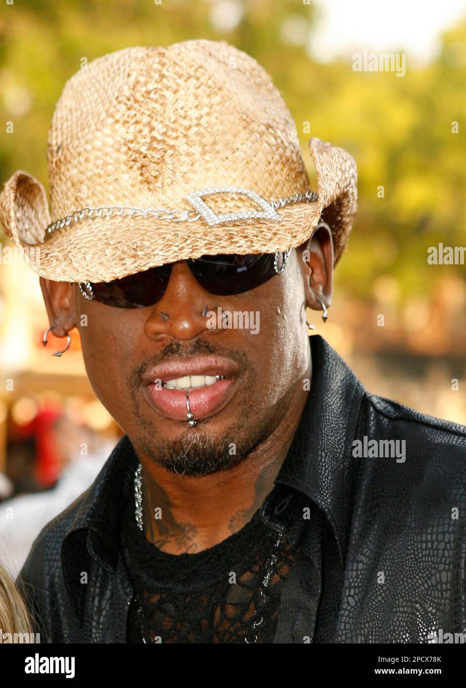 Former NBA basketball player Dennis Rodman poses for photographers at ...