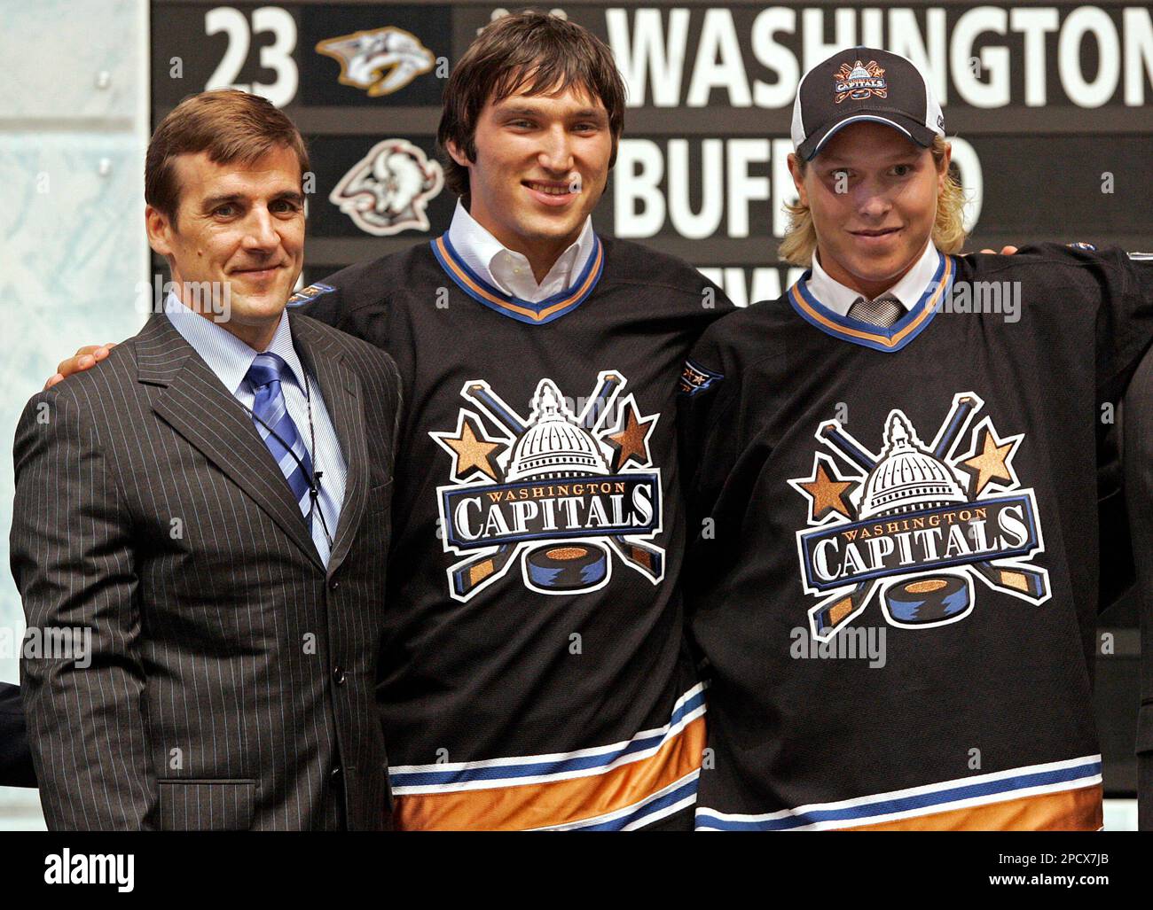 Nicklas Backstrom, right poses for a photo with general manager George ...