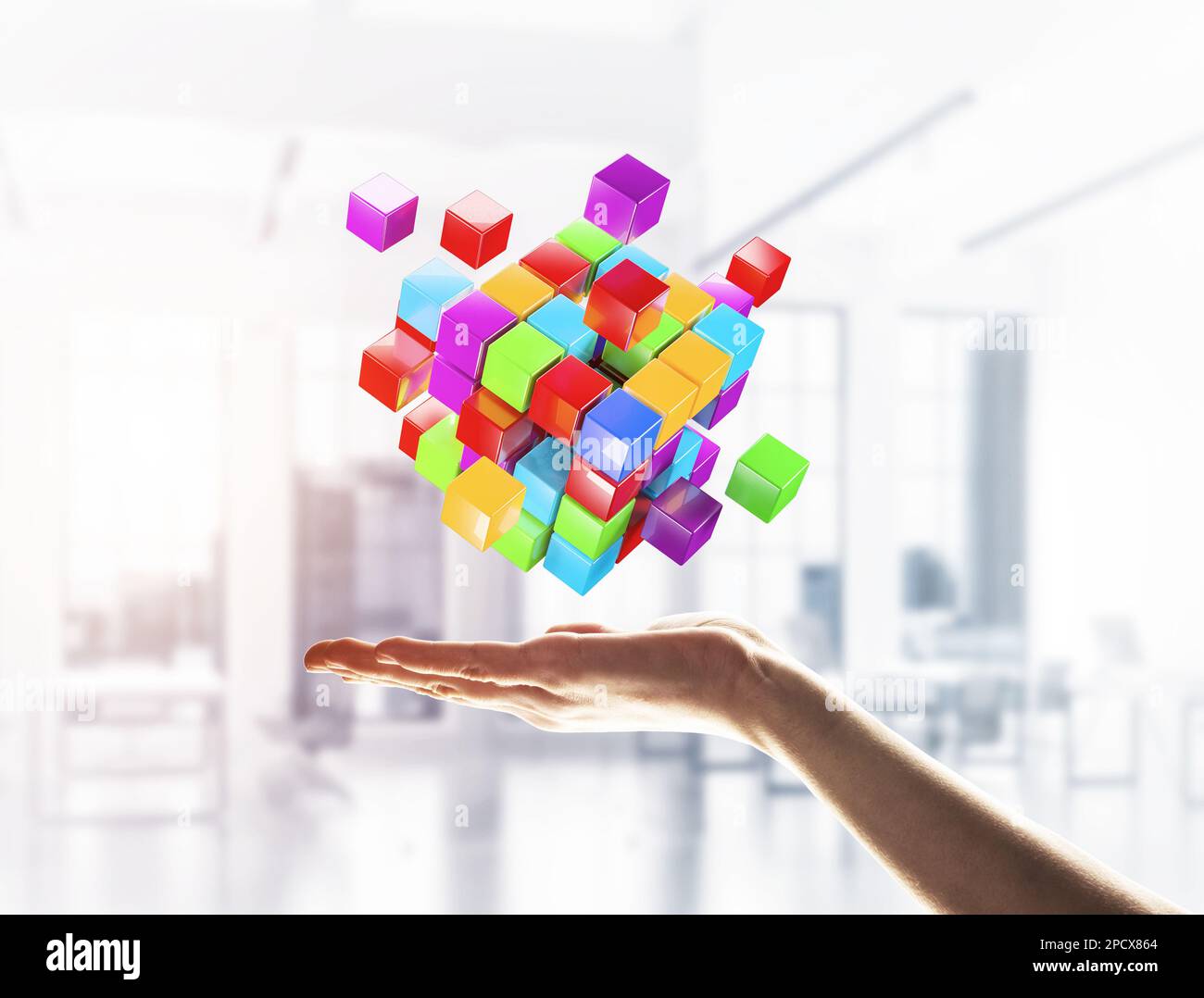 Cube color figure in male palm as symbol for integration. 3D rendering ...