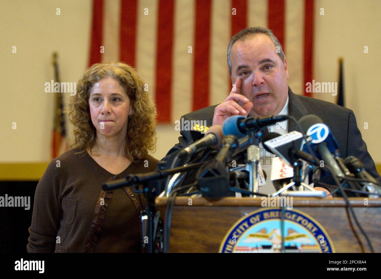 Bridgeport Mayor John M. Fabrizi wipes tears from his eye with his wife ...